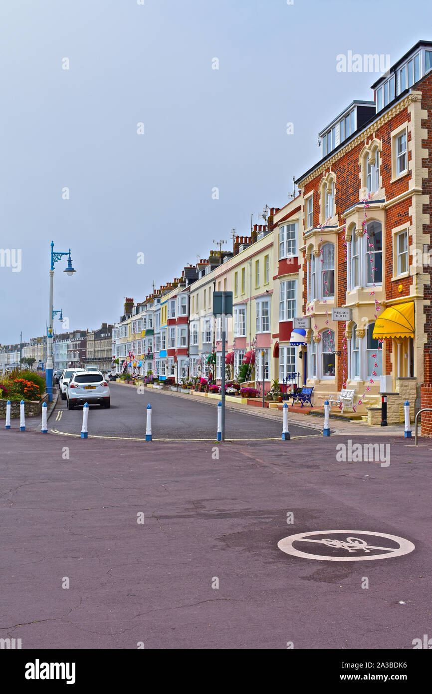 A pretty row of 3 storey traditional seaside hotels, boarding houses ...