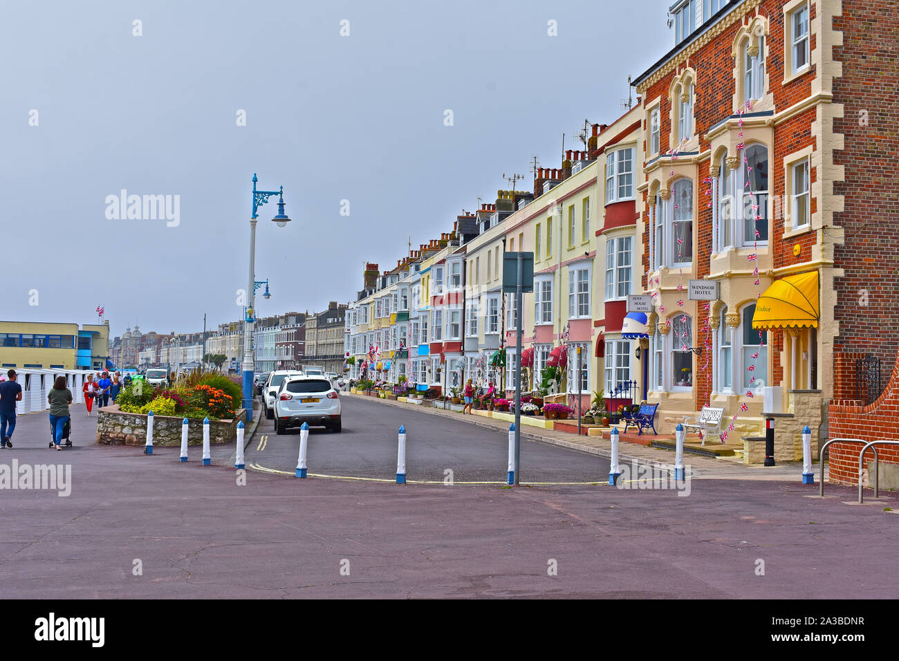 A pretty row of 3 storey traditional seaside hotels, boarding houses ...