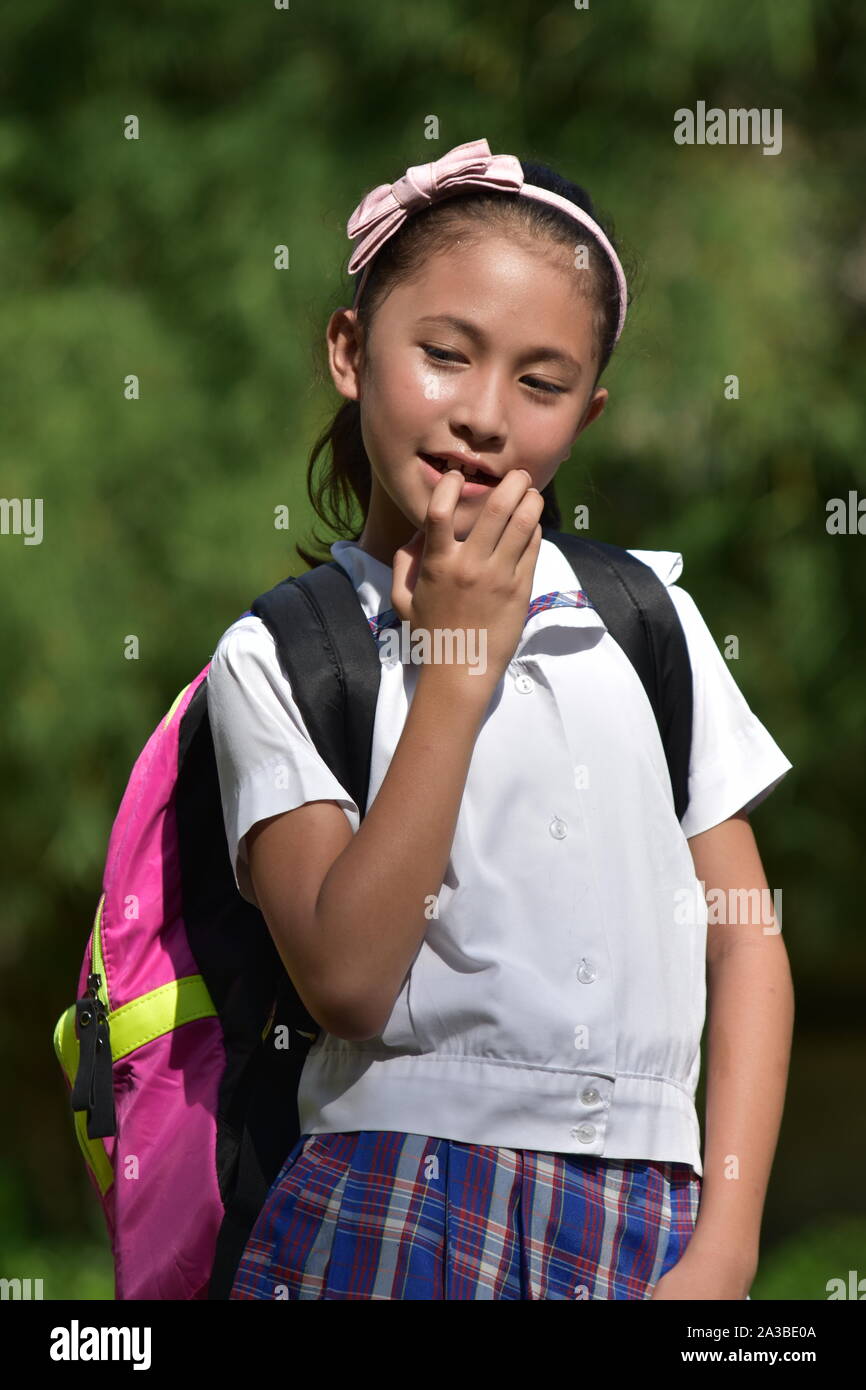 School Girl Decision Making With Books Stock Photo - Alamy