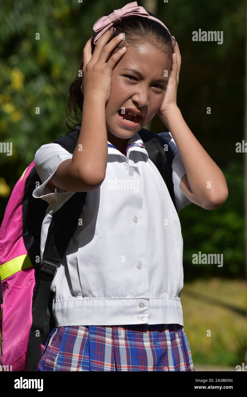 A Stressed Girl Student With Books Stock Photo - Alamy