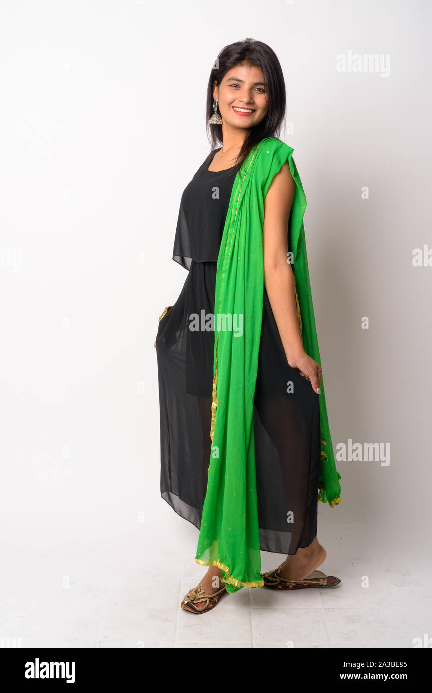 Full body shot of happy young Persian woman smiling in traditional ...