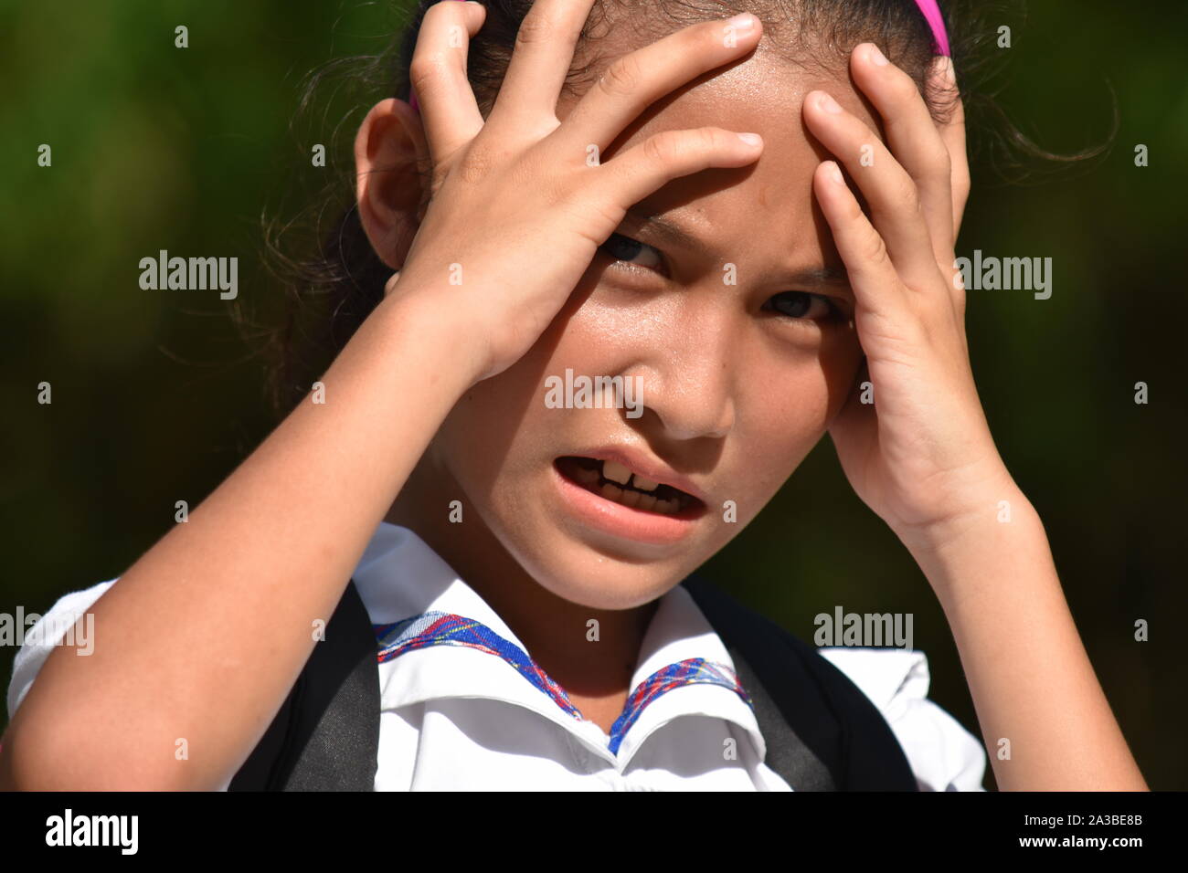 A Stressed Girl Student With Books Stock Photo - Alamy