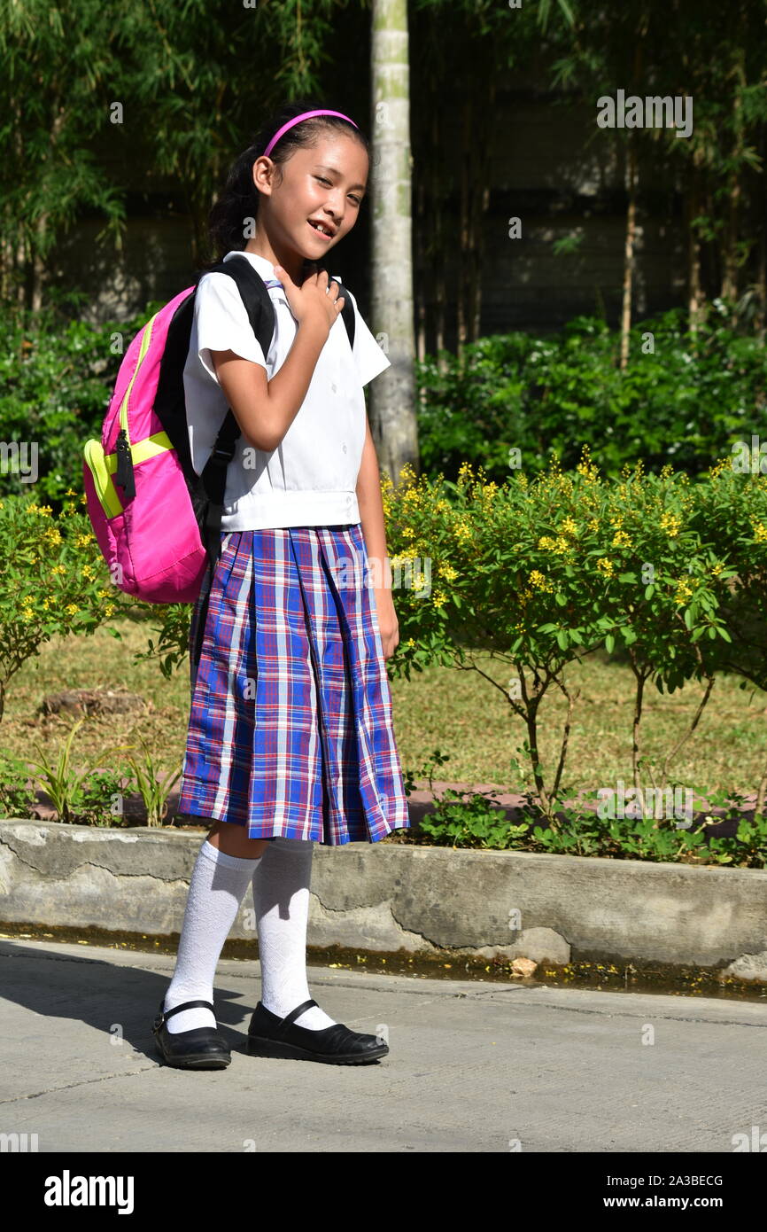 Appreciative Asian Female Student With Books Stock Photo - Alamy