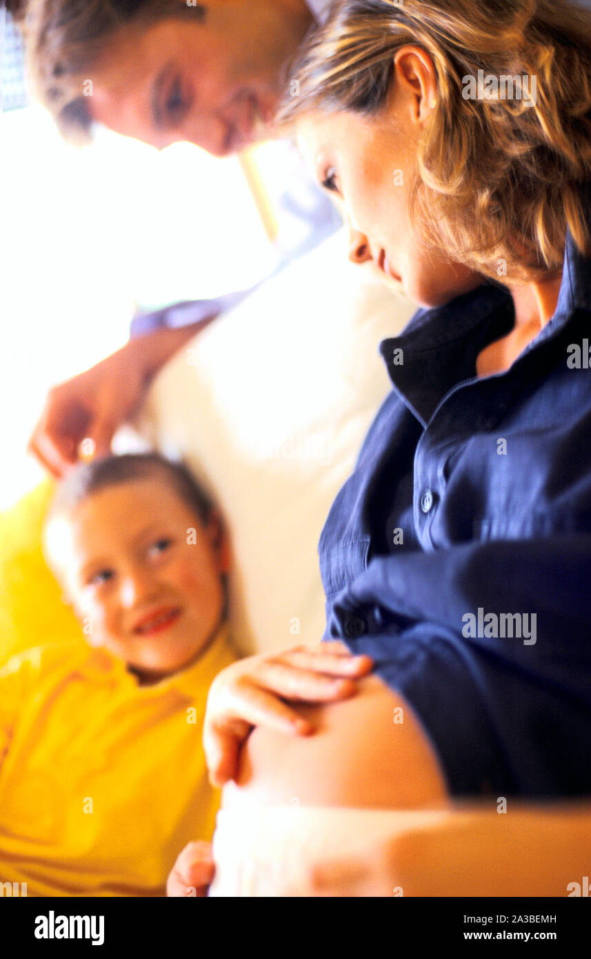 pregnancy, family, sofa Stock Photo - Alamy