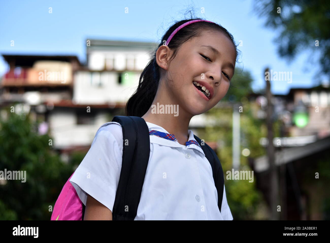A Pretty School Girl Smiling Stock Photo - Alamy