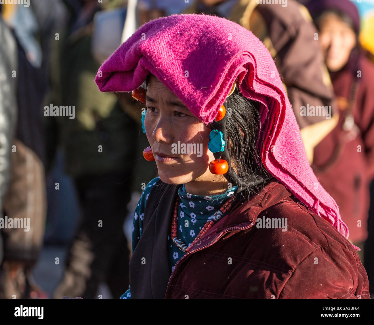 A young Khamba Tibetan woman from the Kham region of eastern Tibet with ...