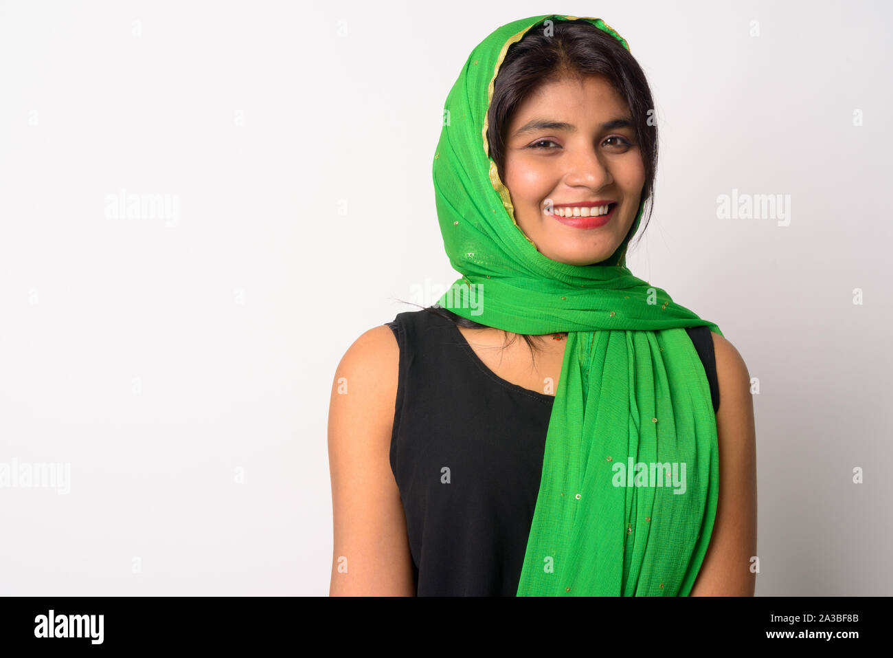 Face of happy young Persian woman smiling in traditional clothing Stock ...