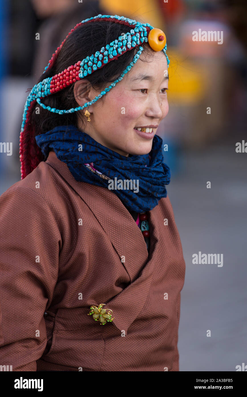 A young Khamba Tibetan woman from the Kham region of Tibet on a ...