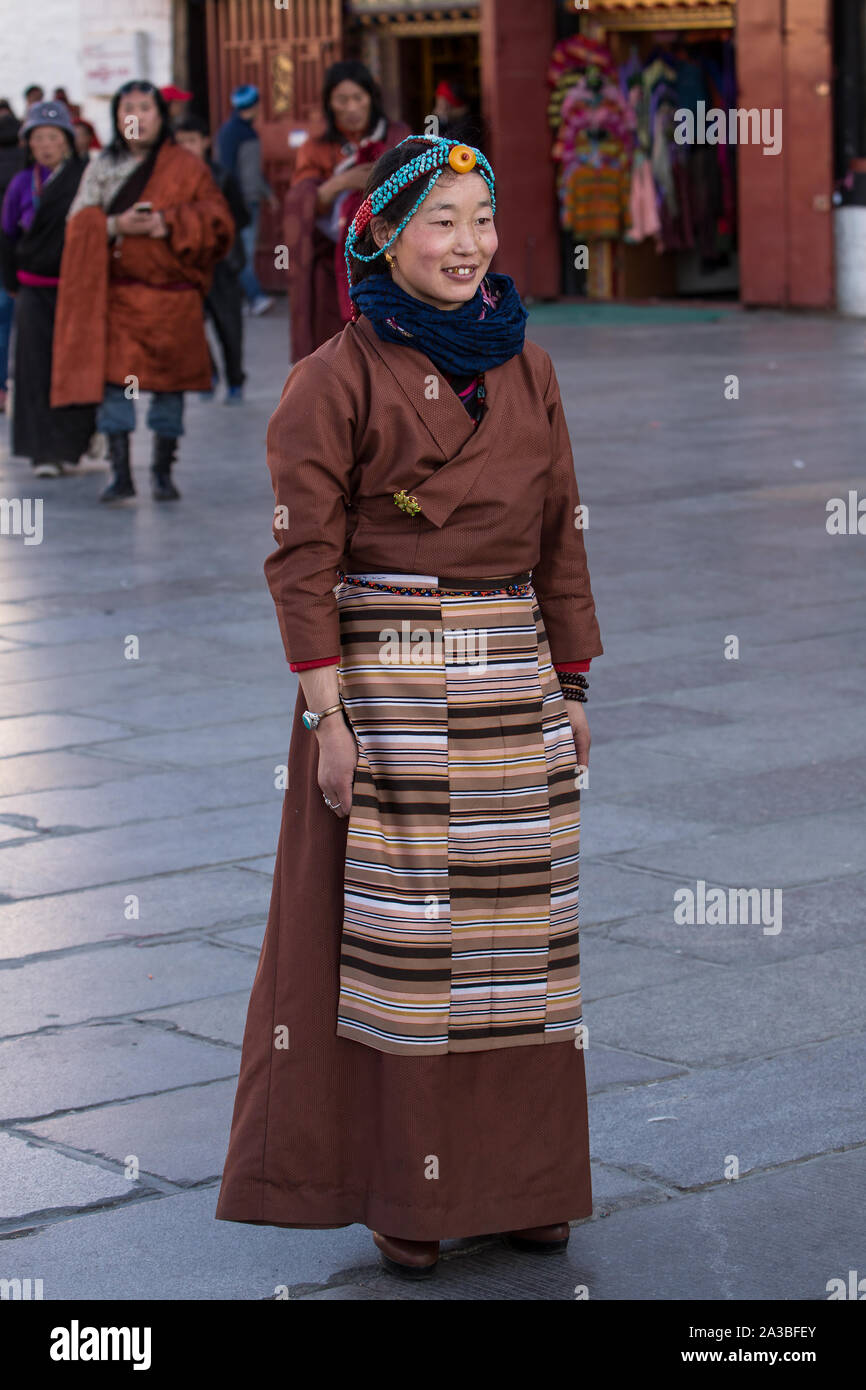 A young Khamba Tibetan woman from the Kham region of eastern Tibet on a ...
