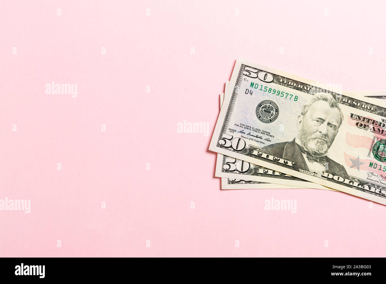 Top view of bundle of 50 dollar bill on colorful backgound. Business ...