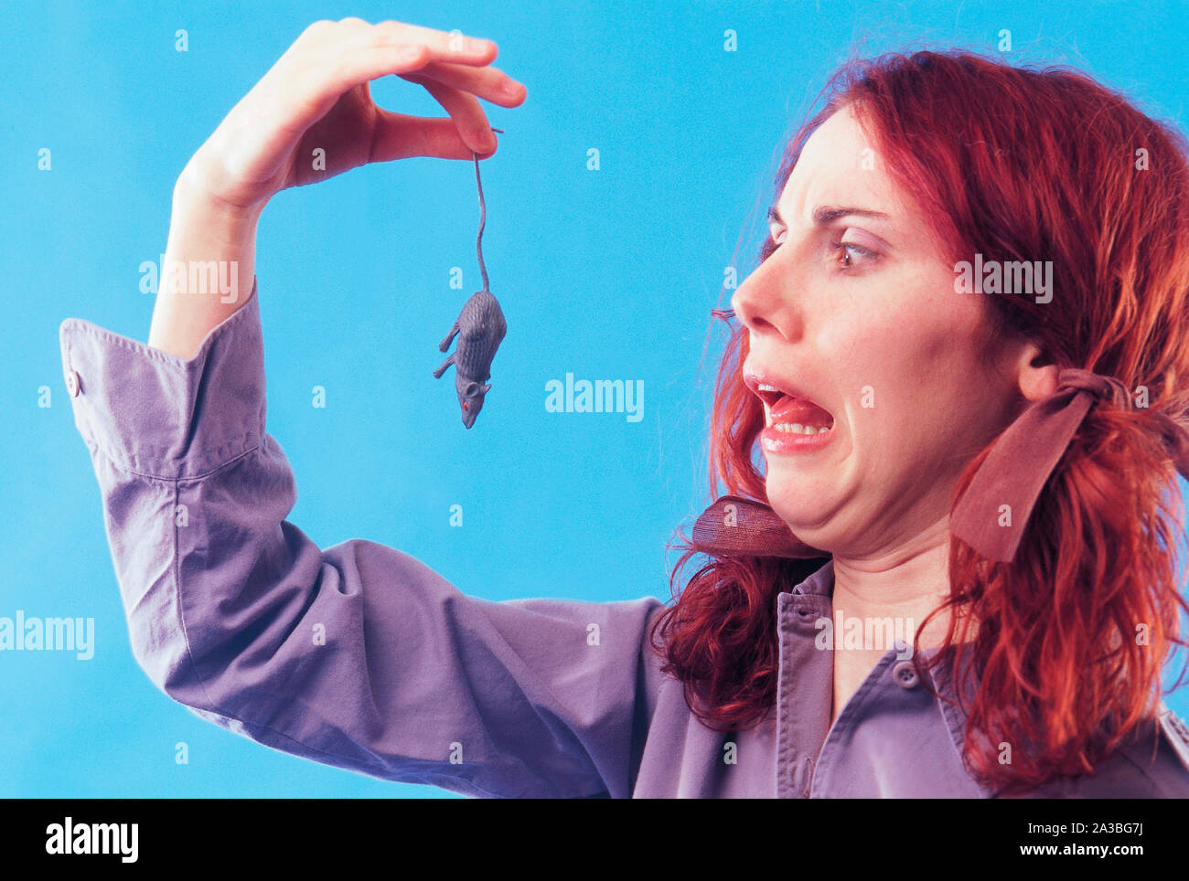 girl with a toy-mouse Stock Photo - Alamy