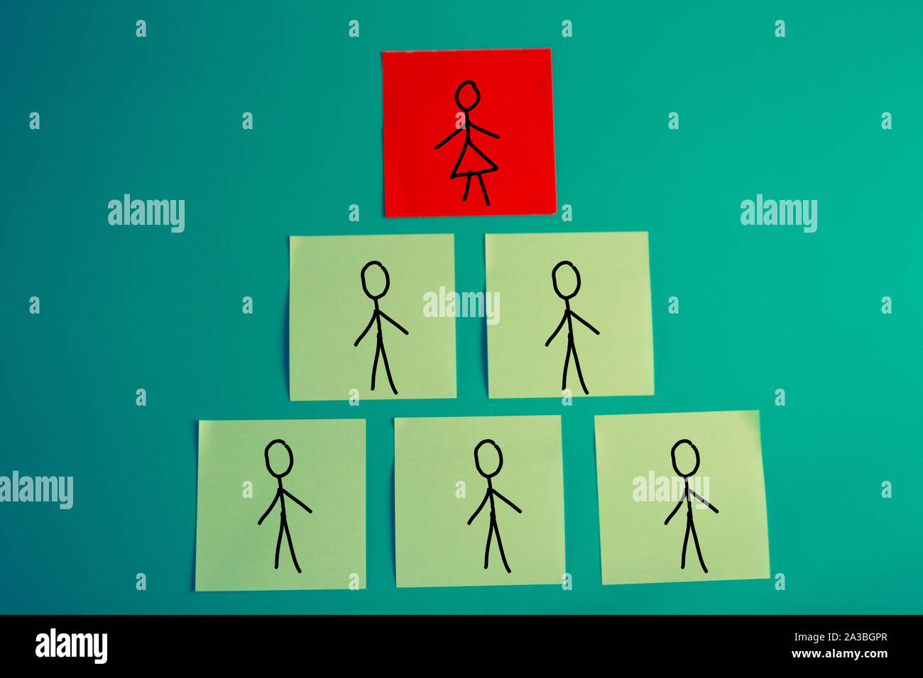 Powerful businesswoman concept. Woman on top of pyramid Stock Photo - Alamy