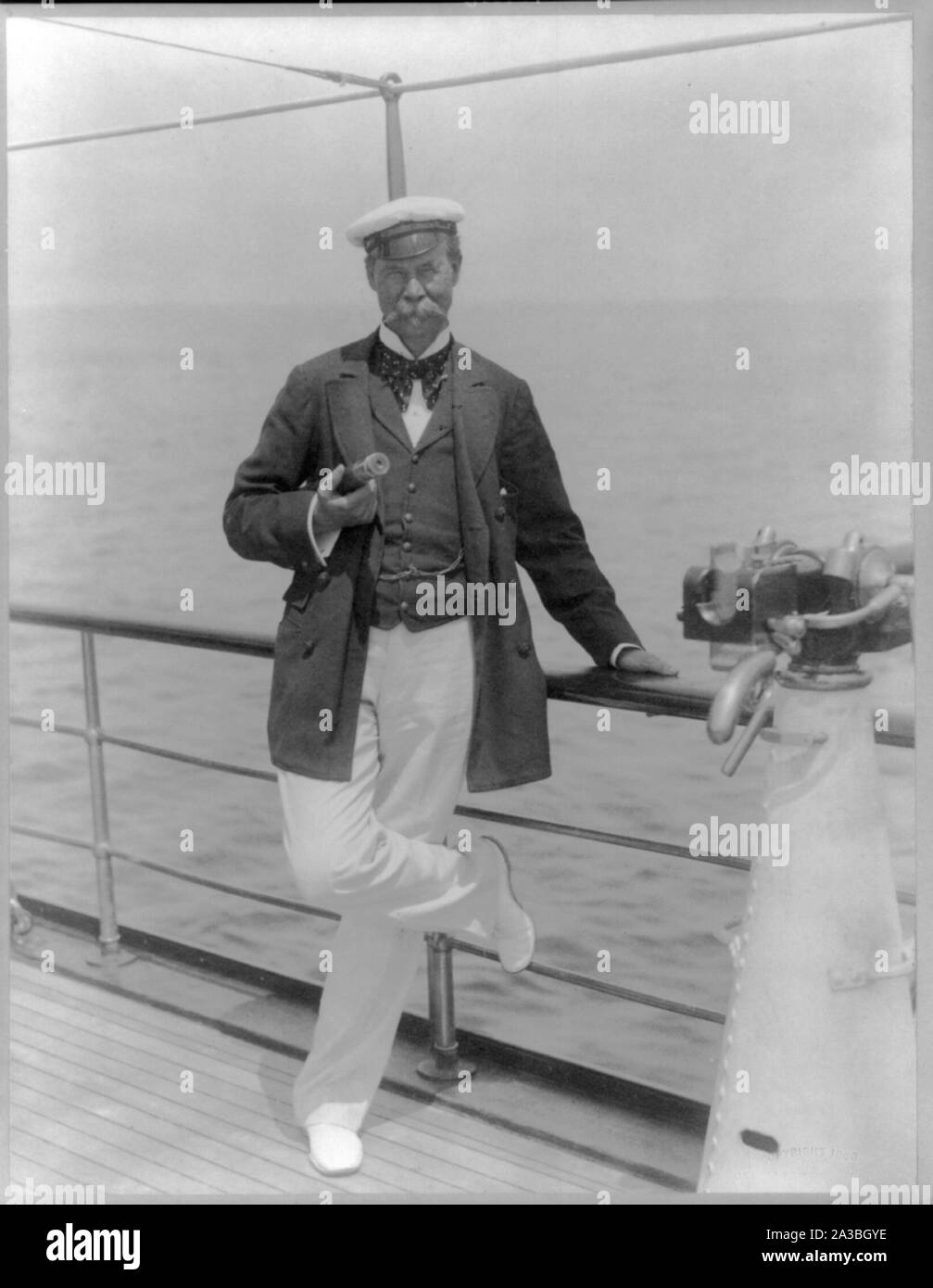 Sir Thomas Lipton, full-length portrait, standing at rail of his yacht ...
