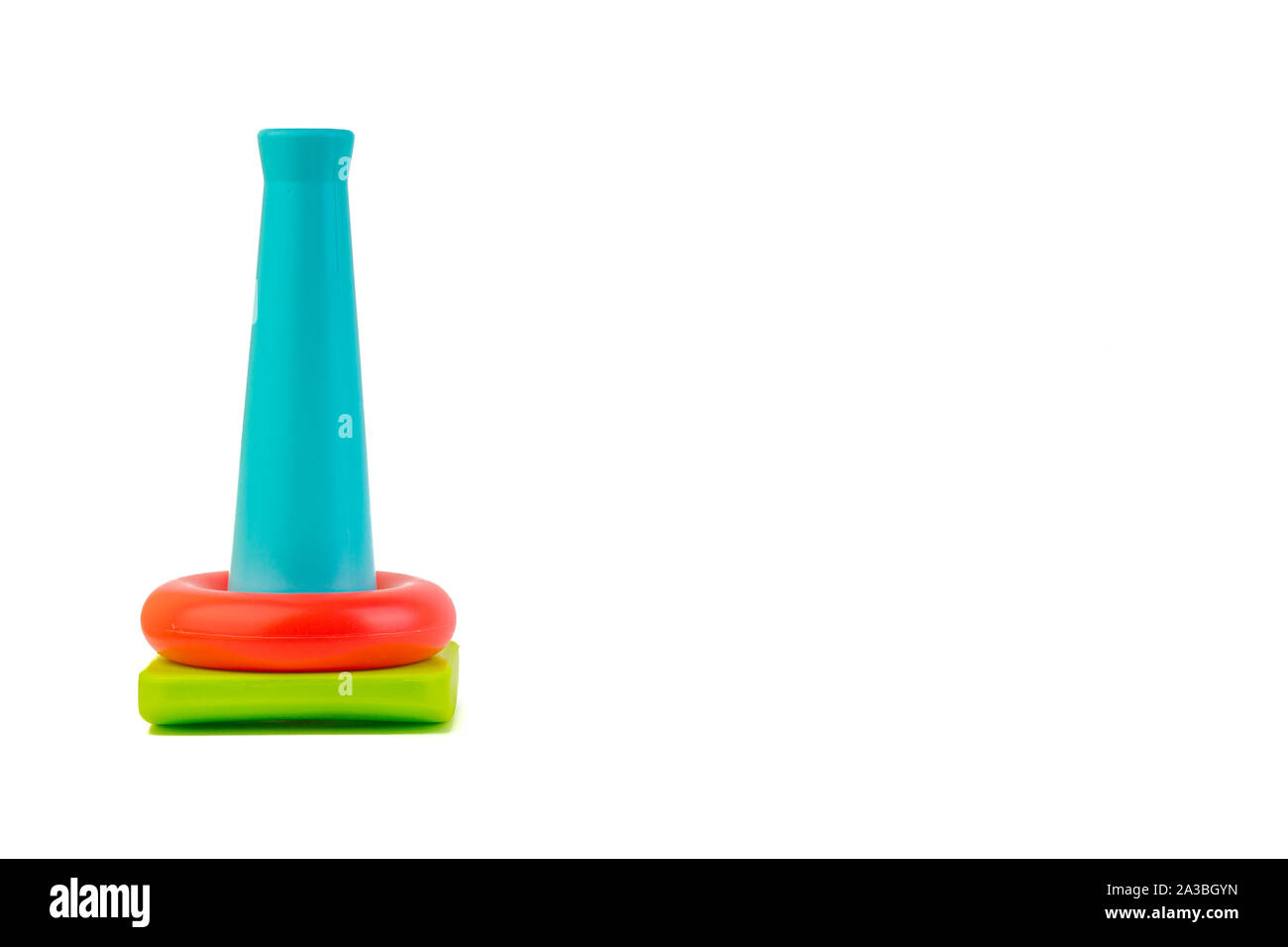 Plastic toy pyramid on a white background. Games and Copy space concept ...