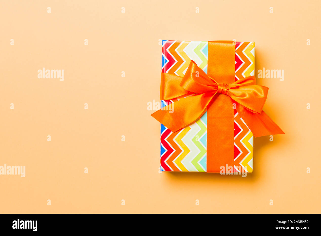 wrapped Christmas or other holiday handmade present in paper with ...