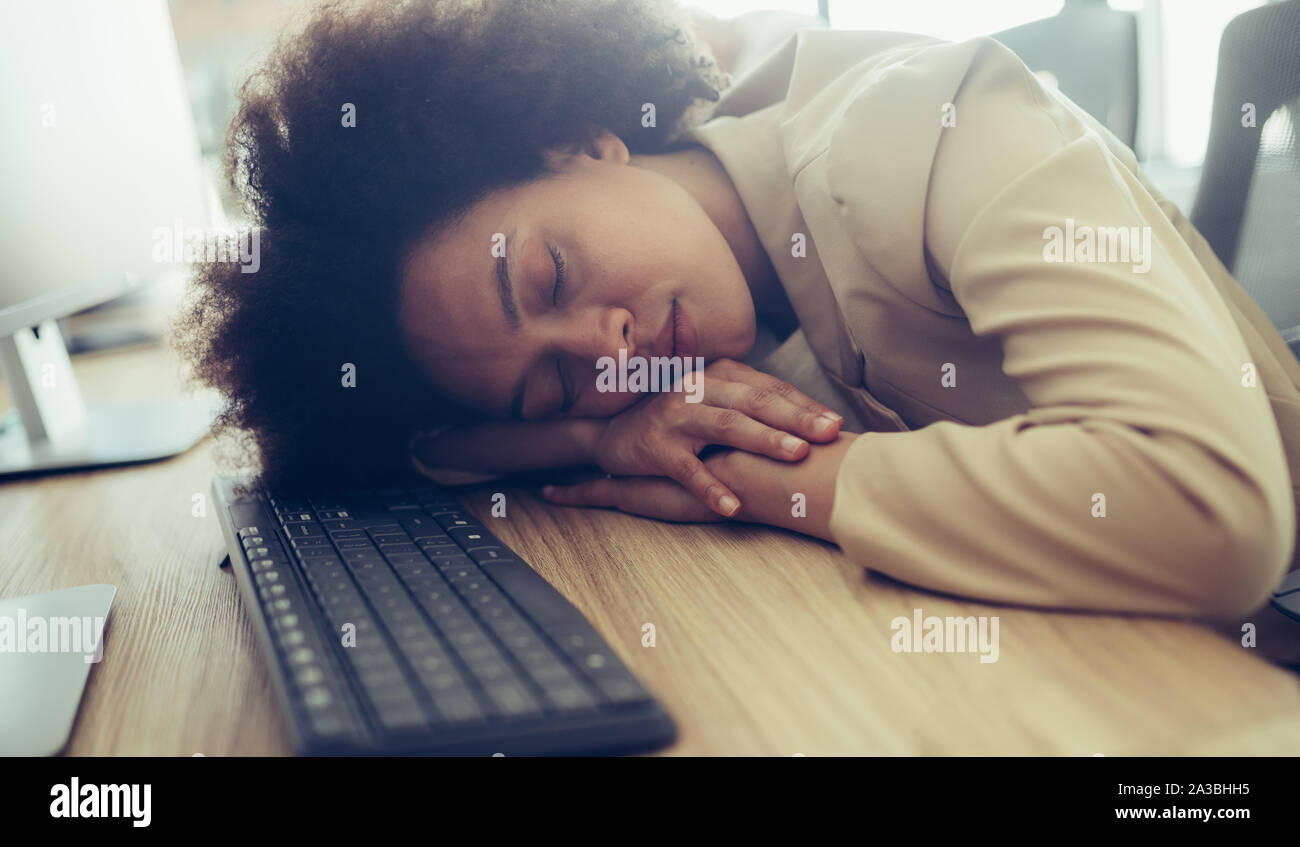 Portrait of an exhausted business woman sleeping at work Stock Photo ...