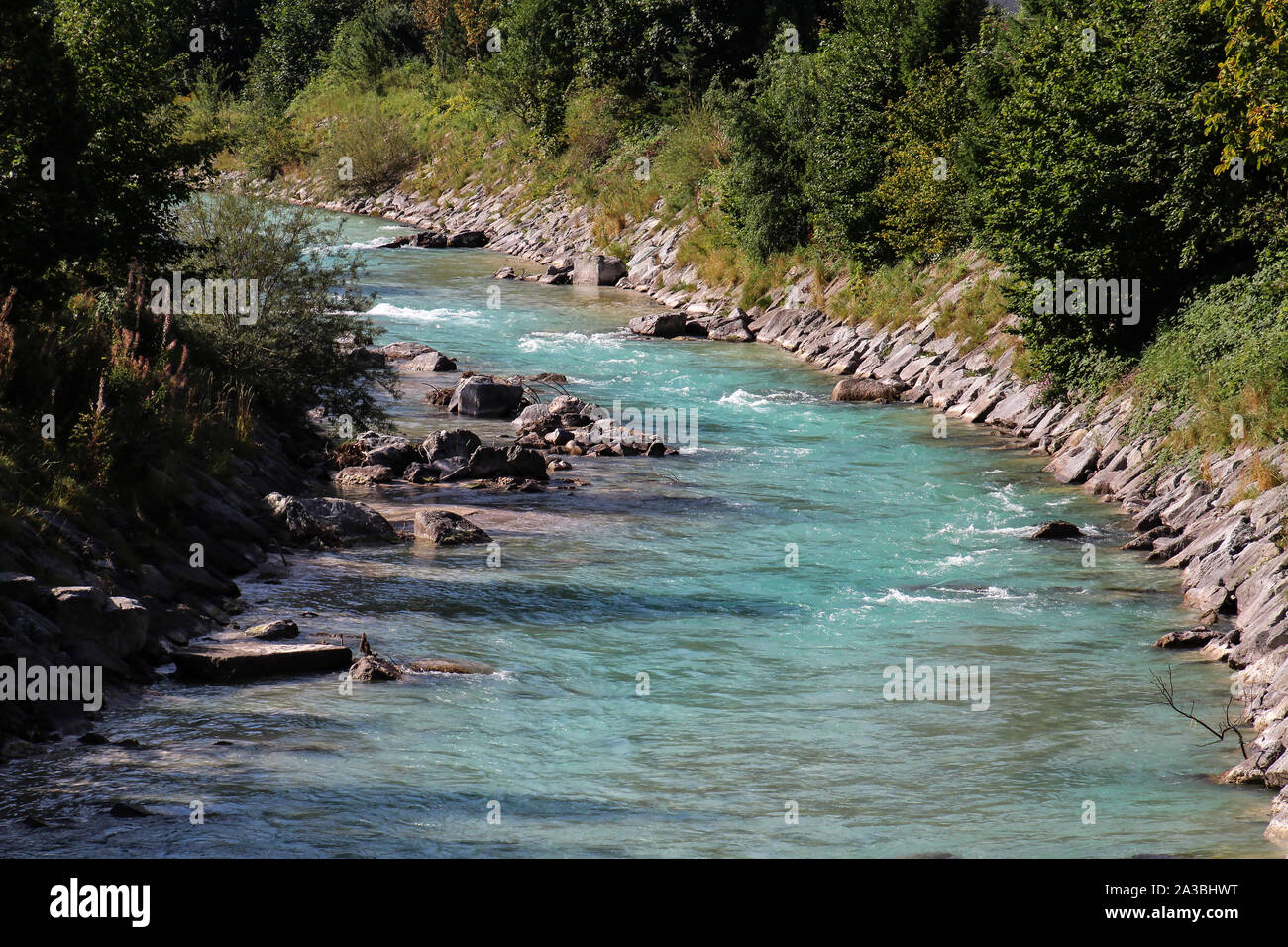 Mountain landscape with a small river in the Alps Stock Photo - Alamy