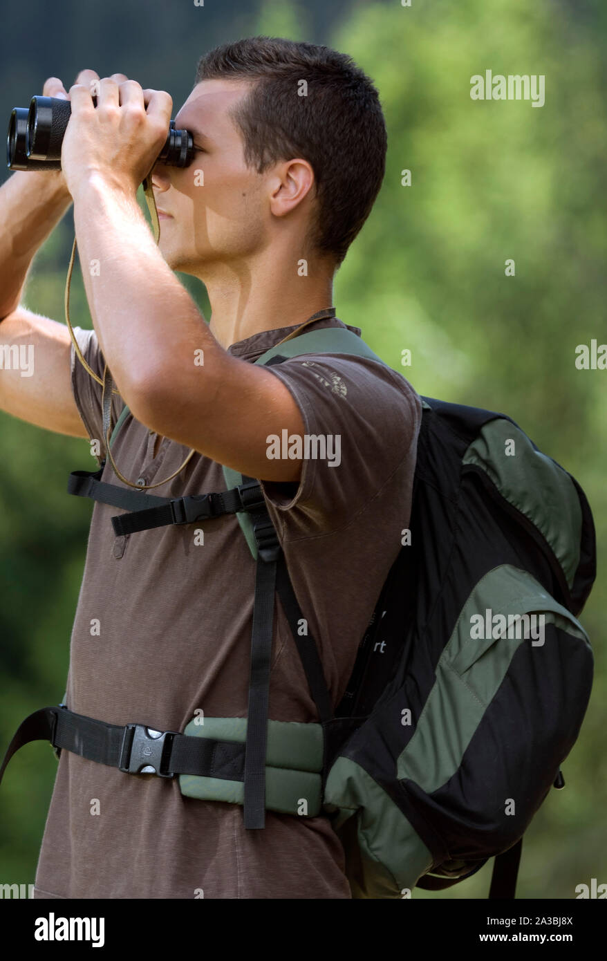 man with binoculars, mountain Stock Photo - Alamy