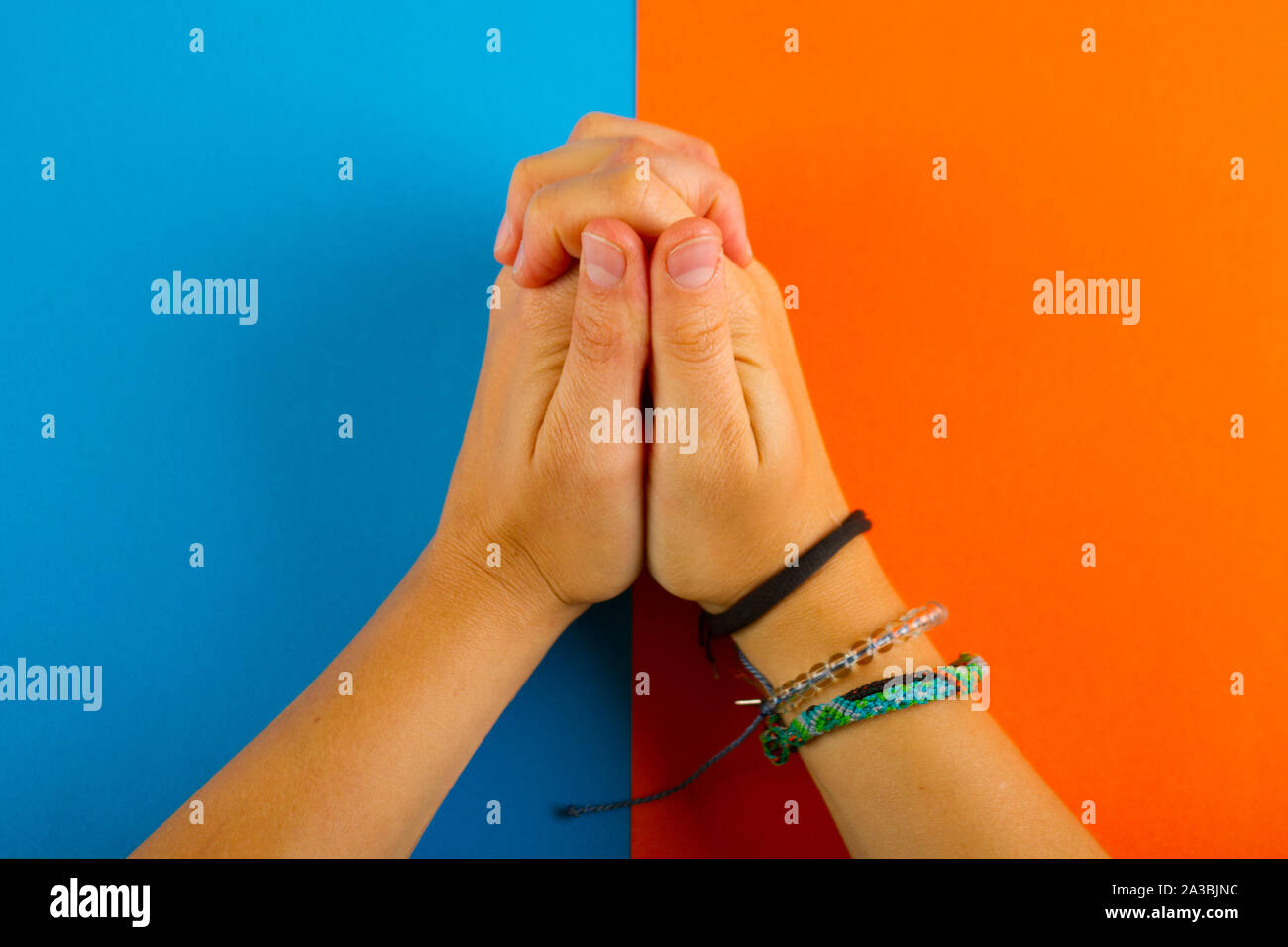 Praying hands on colorful background. Praying concept Stock Photo - Alamy
