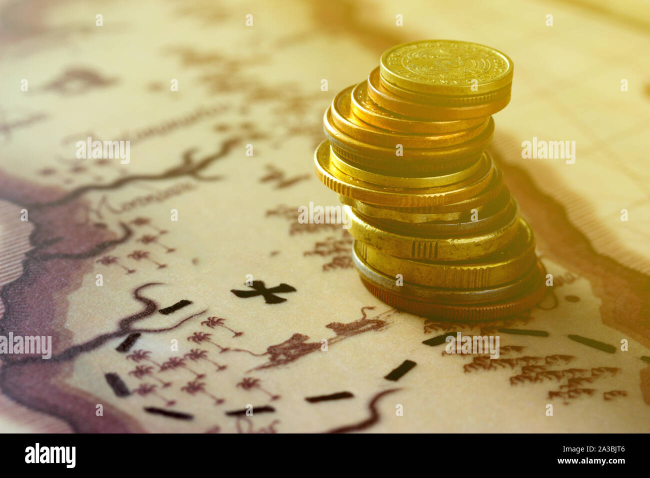 Old pirate map with gold coins. Toned image Stock Photo - Alamy