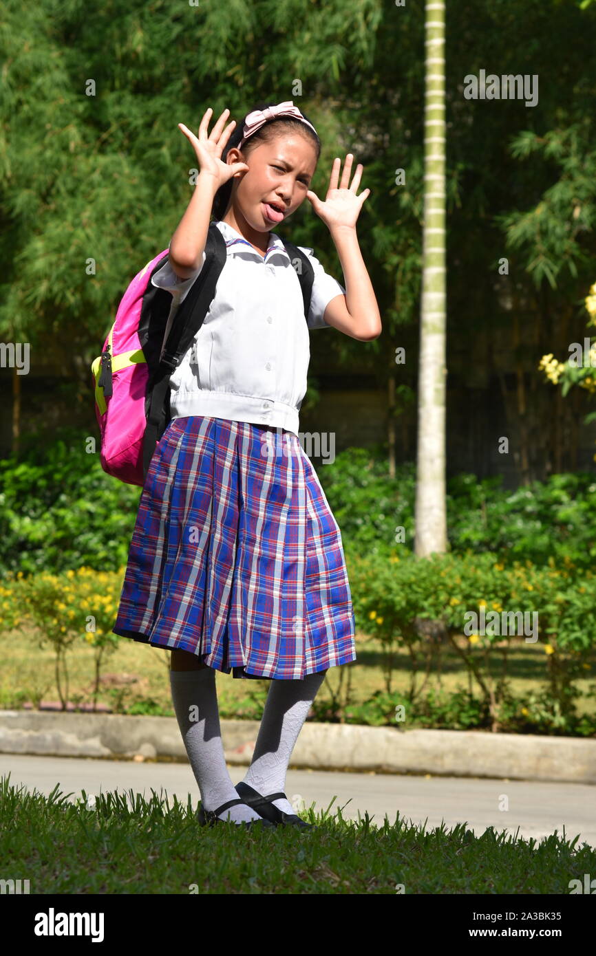 Young Female Student Making Funny Faces Wearing School Uniform Stock ...