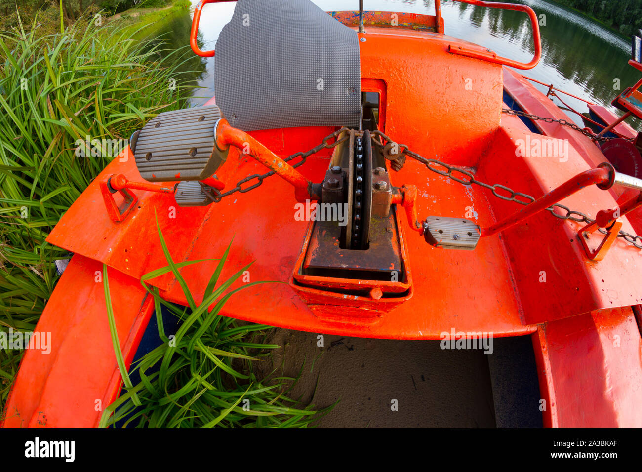 Old orange catamaran on lake. Hipster lifestyle Stock Photo - Alamy