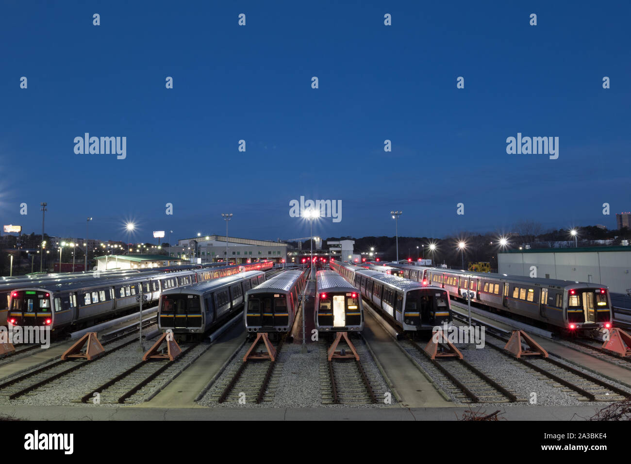Trains in a mass transit commuter yard in predawn light Stock Photo - Alamy