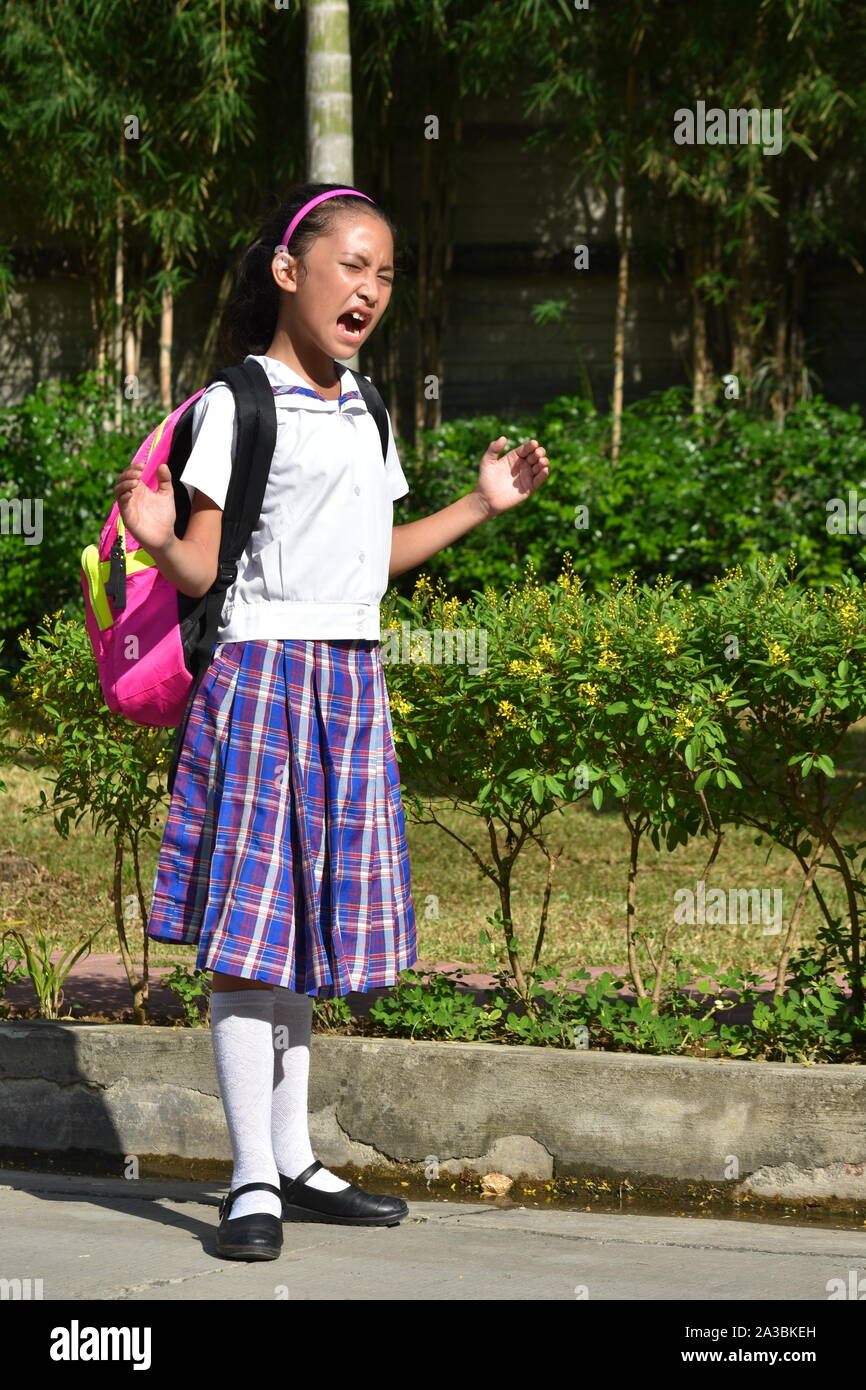 Minority Female Student Yelling With Notebooks Stock Photo - Alamy