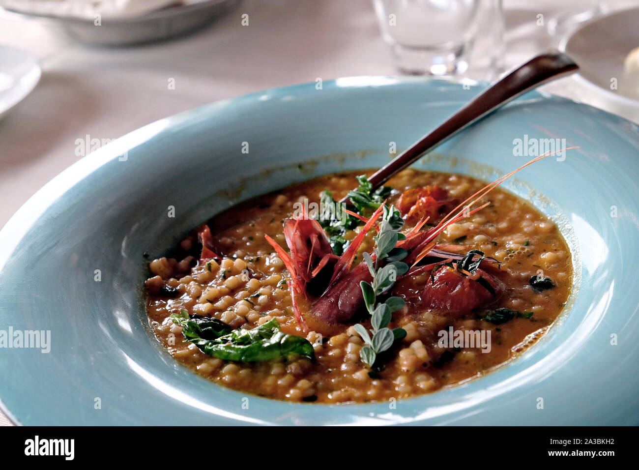 typical sardinian dish: fregola with seafood Stock Photo - Alamy