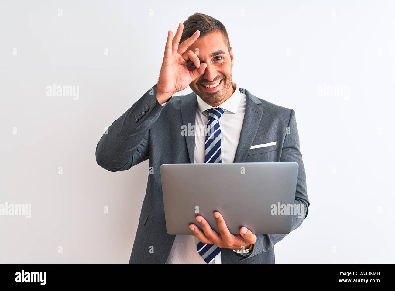 Young handsome business man working using computer laptop over isolated ...
