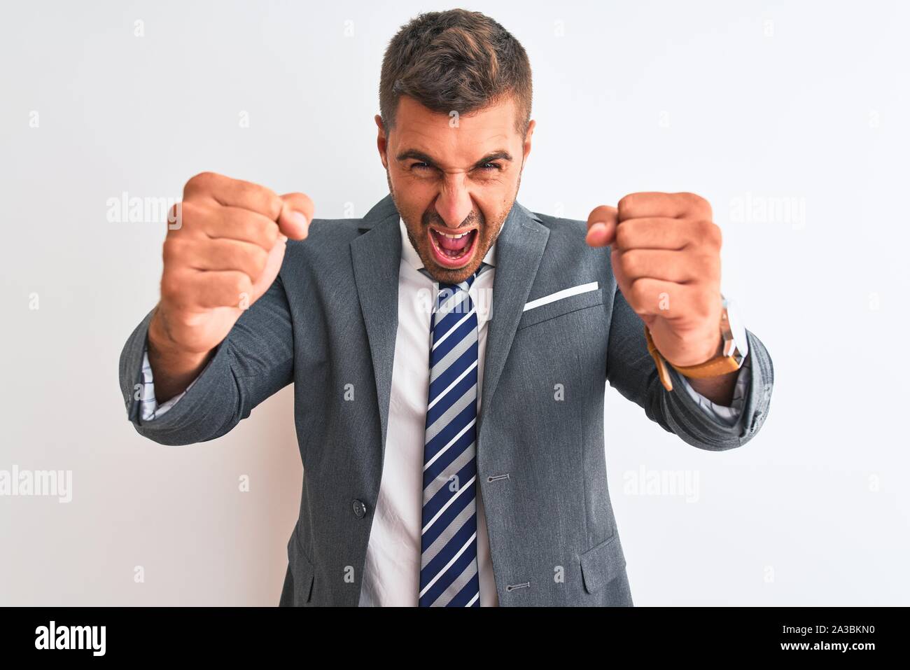 Young handsome business man wearing suit and tie over isolated ...