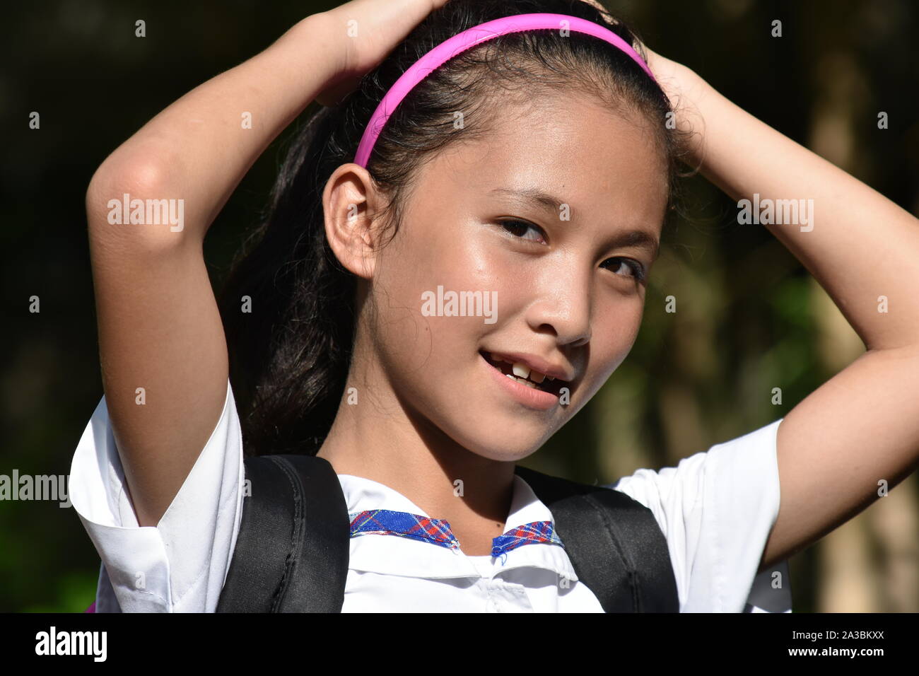 A Forgetful Girl Student With Notebooks Stock Photo - Alamy