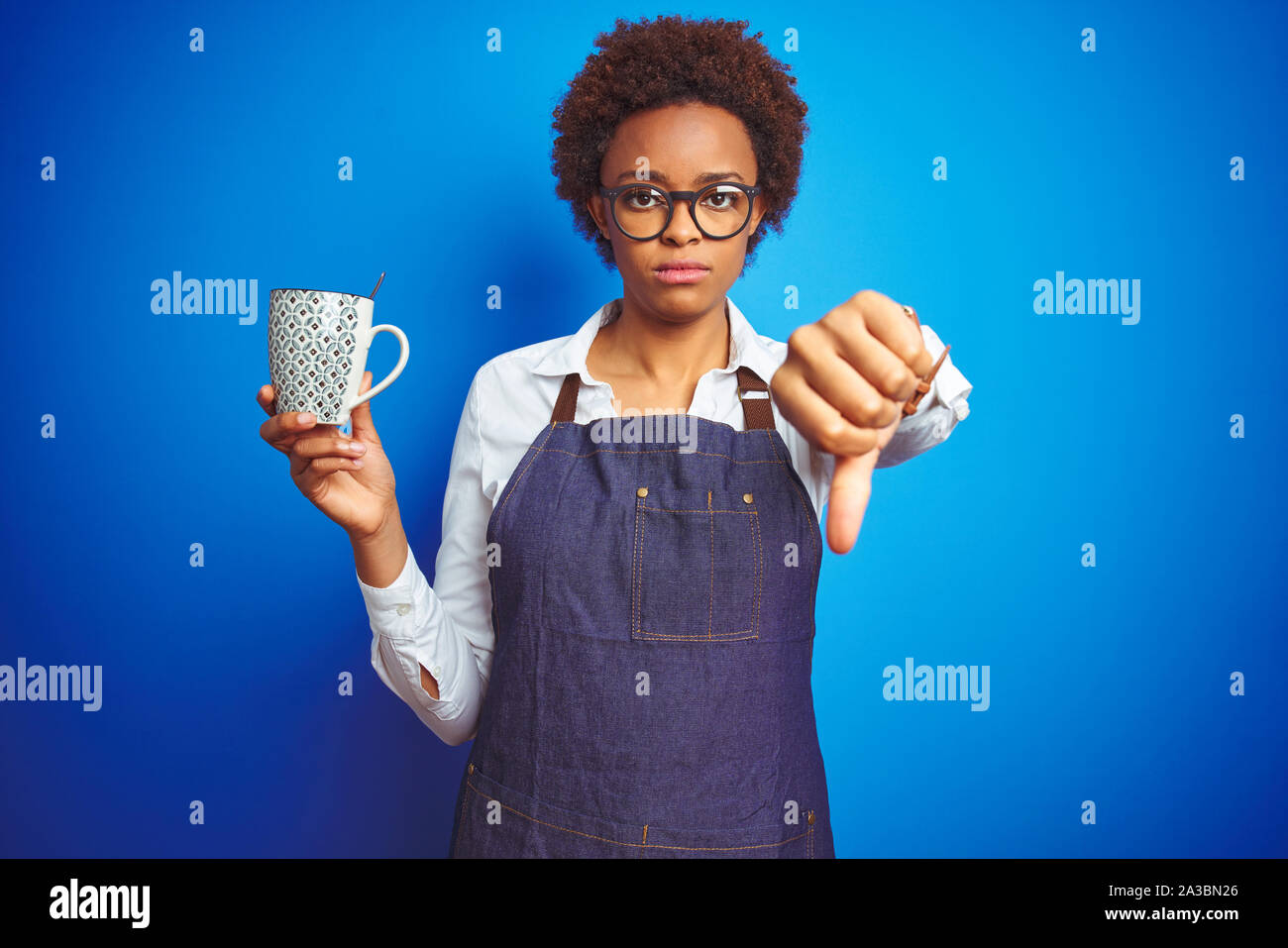 African american barista woman wearing bartender uniform holding cup ...