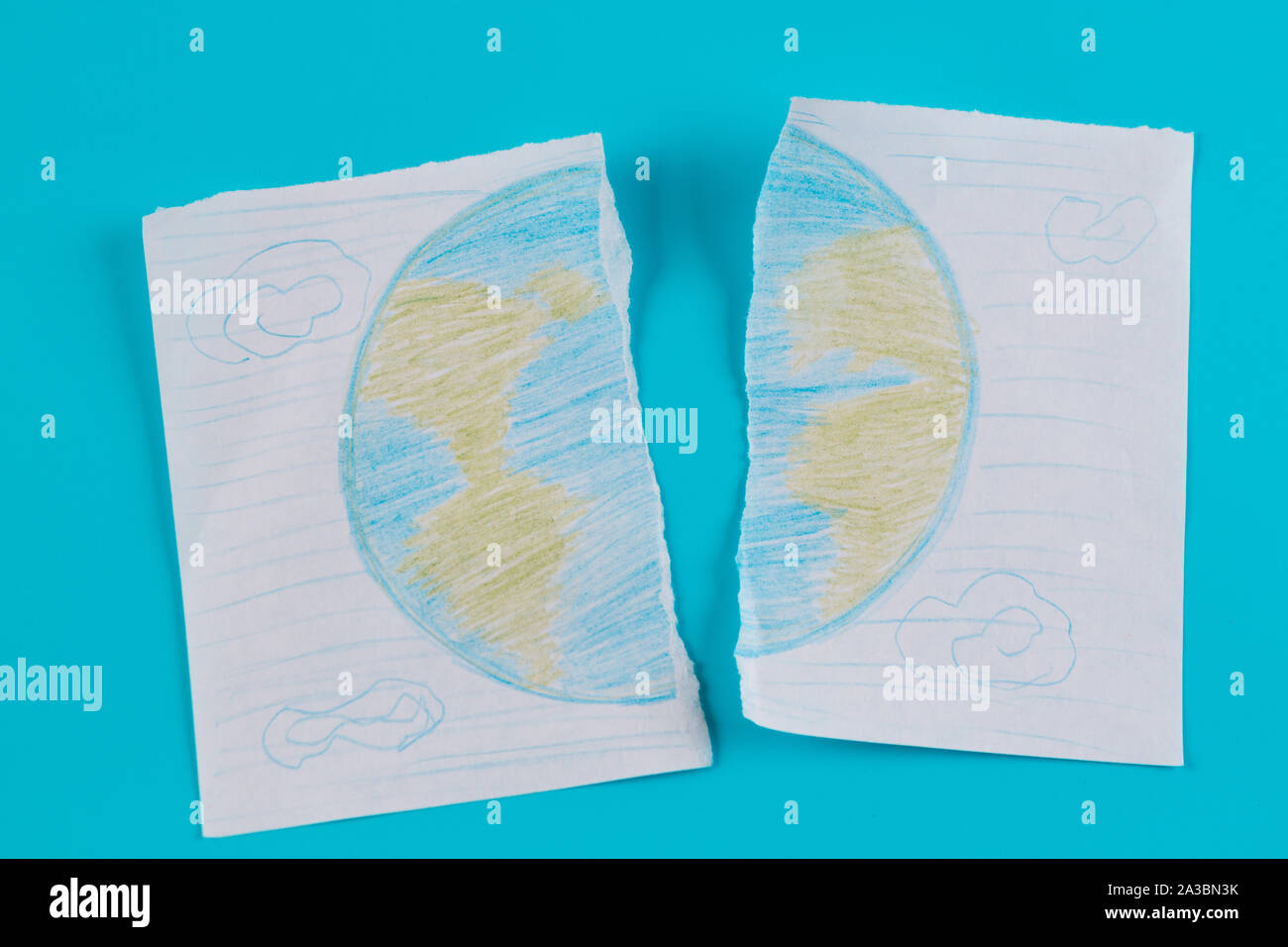 Drawing og the earth planet. Torn into pieces Stock Photo - Alamy