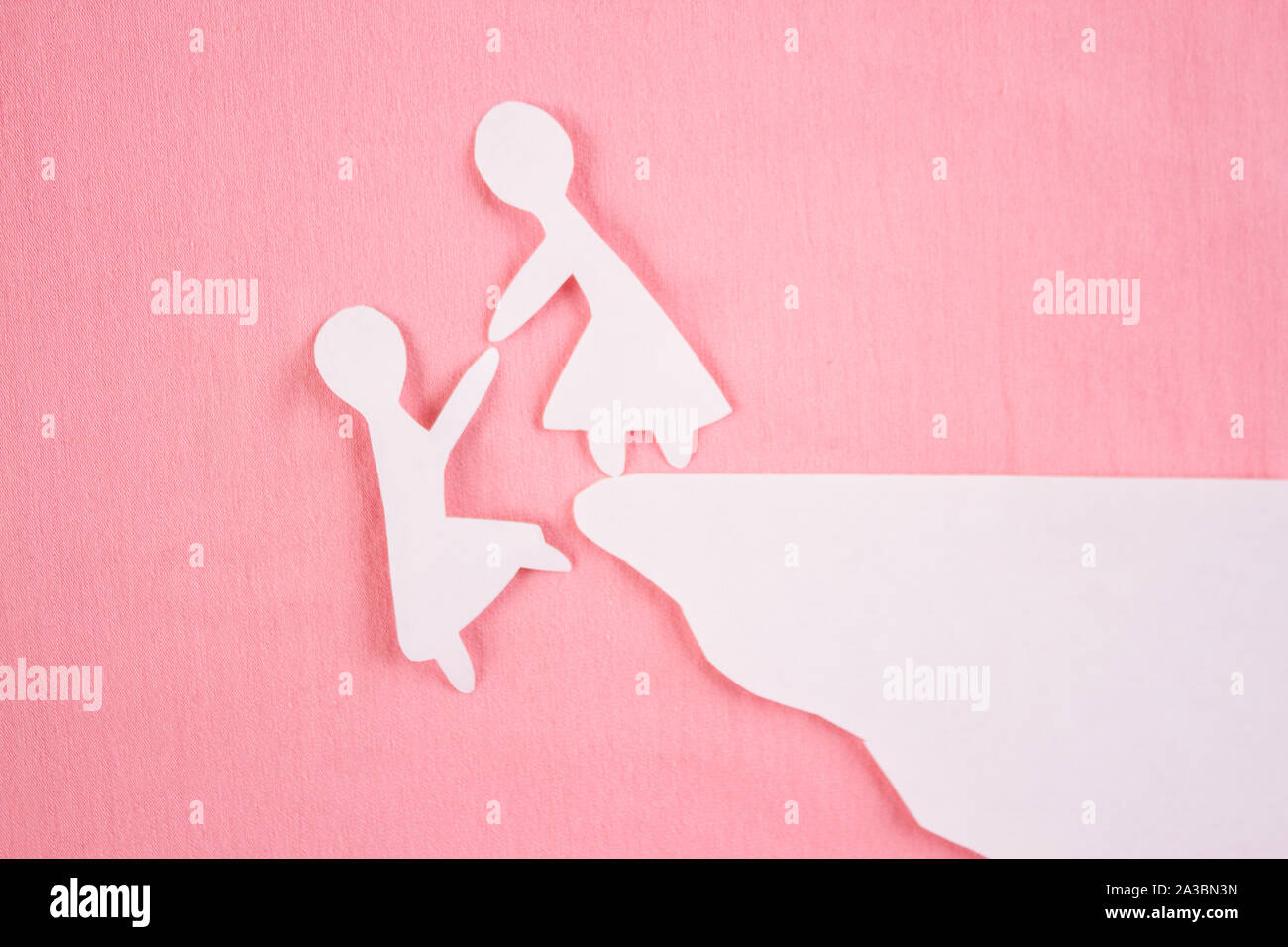 Female solidarity concept. Two paper woman helping each other Stock ...