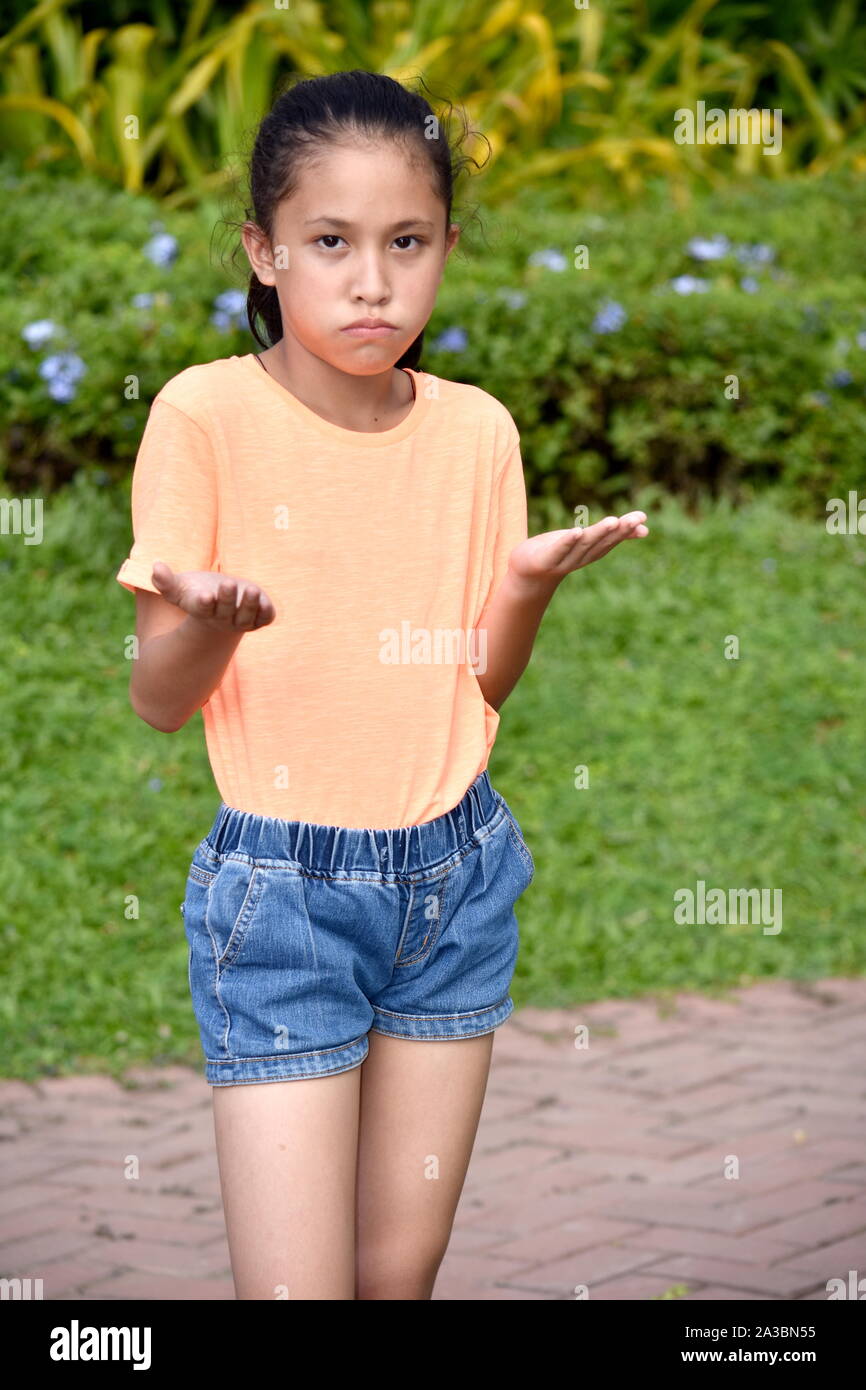 An Undecided Youthful Teenager Girl Stock Photo - Alamy