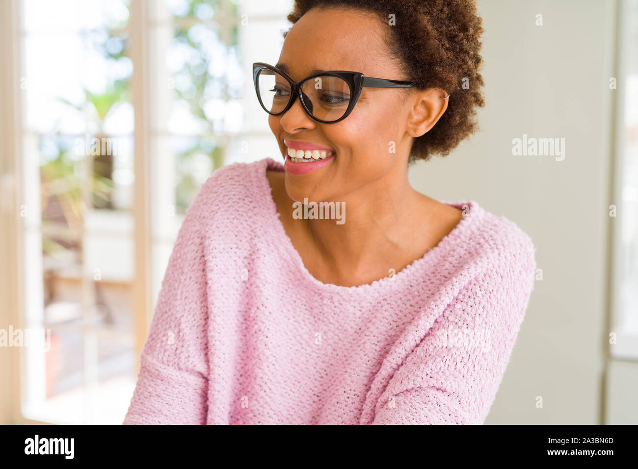 Beautiful young african woman with afro hair wearing glasses Stock ...