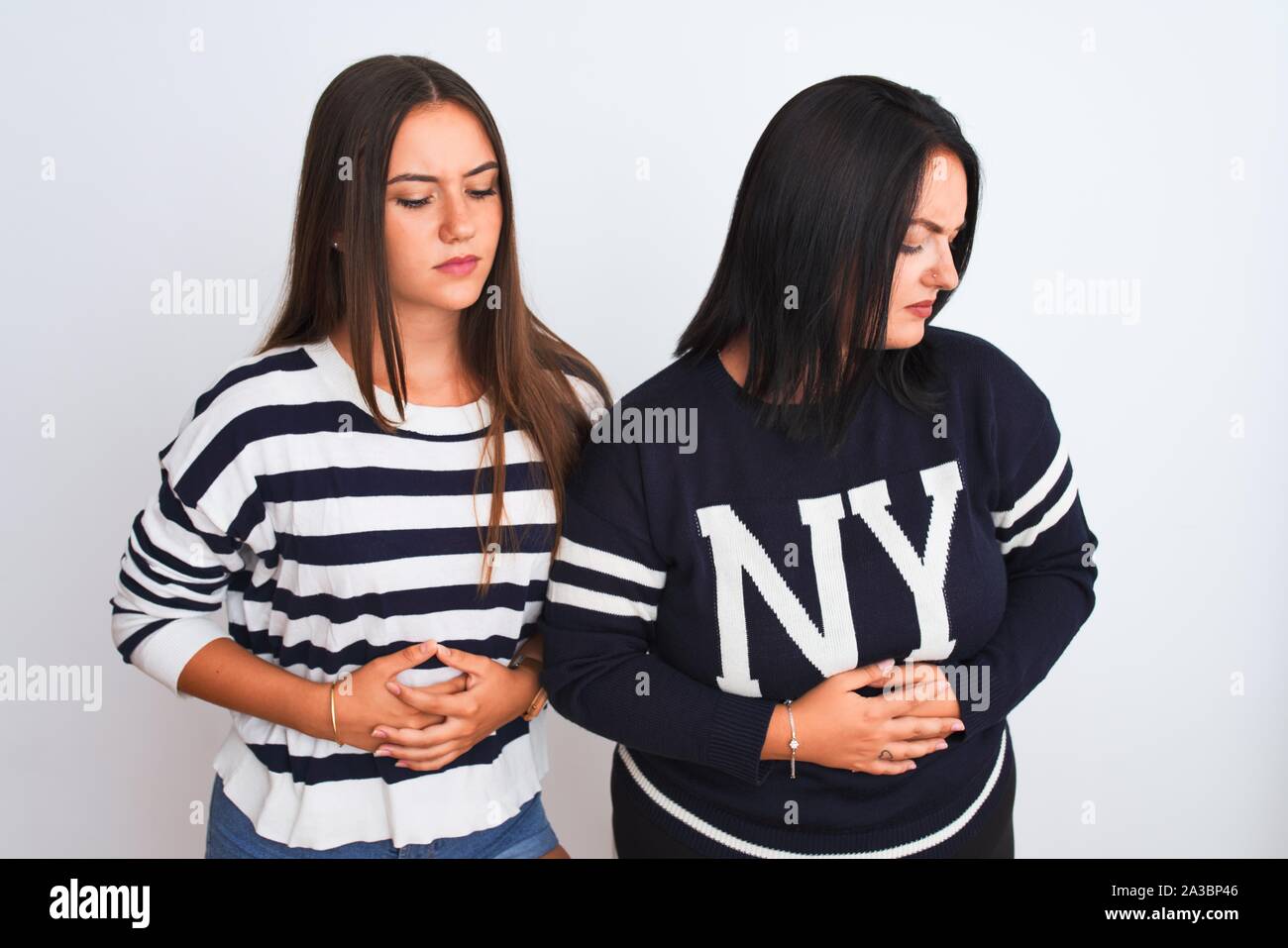 Young beautiful women wearing casual clothes standing over isolated ...