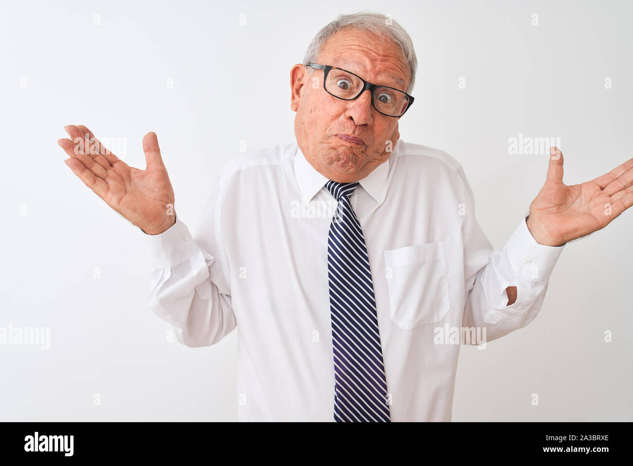 Senior grey-haired businessman wearing tie and glasses over isolated ...