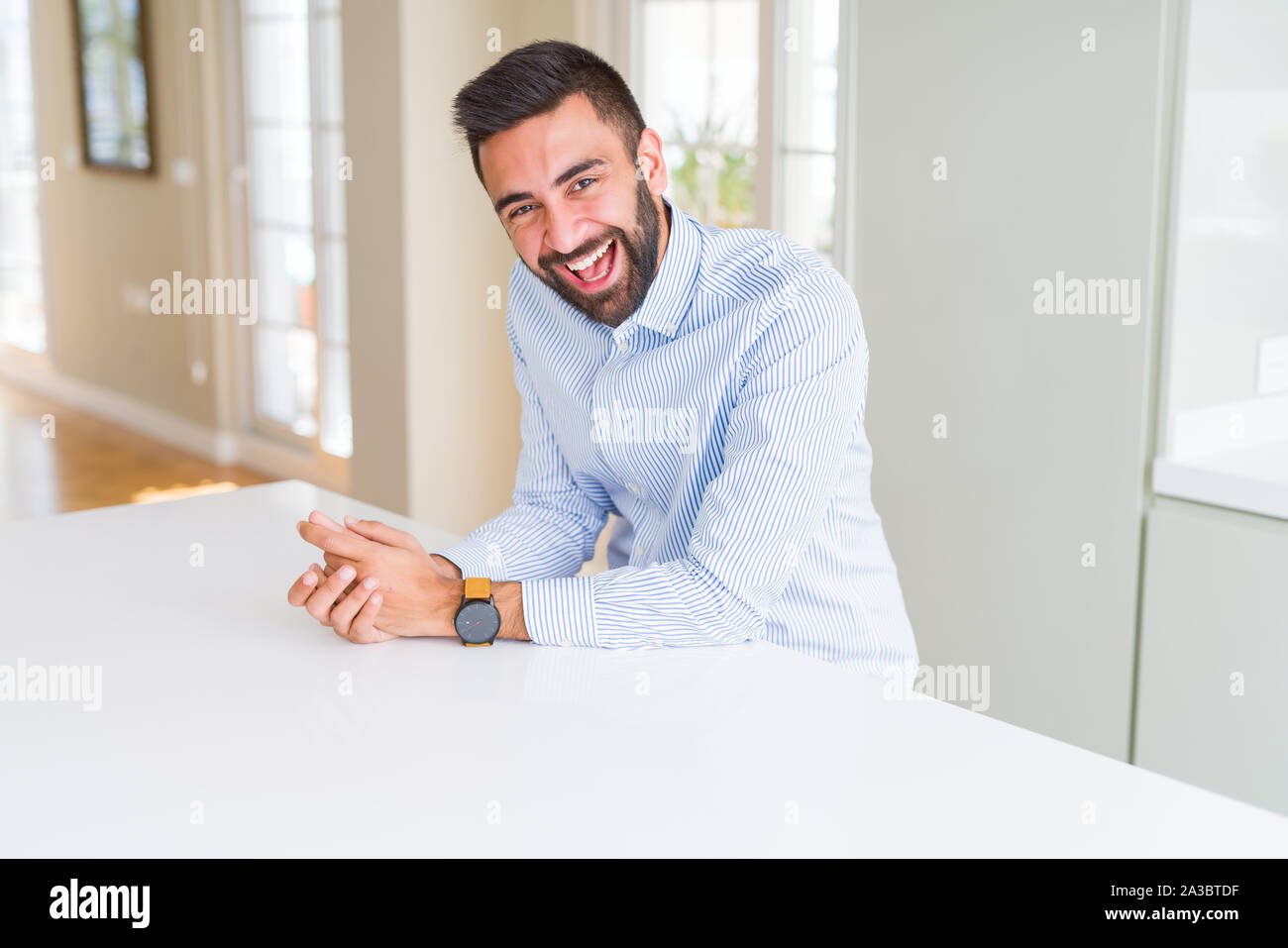Handsome man smiling cheerful with a big smile on face showing teeth ...