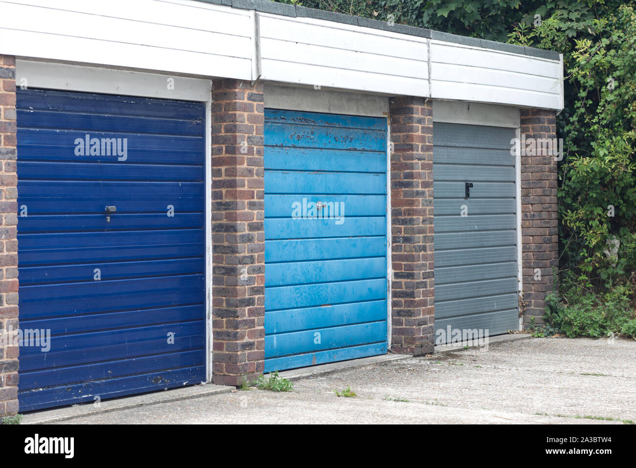 vintage garage doors on a council estate in London Stock Photo - Alamy