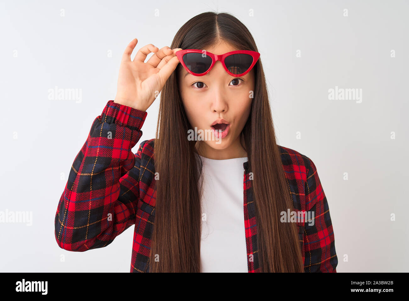 Young chinese woman wearing casual jacket and sunglasses over isolated ...