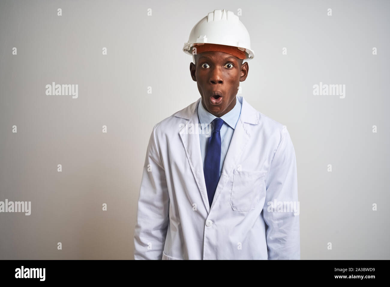 African american engineer man wearing coat and helmet over isolated ...