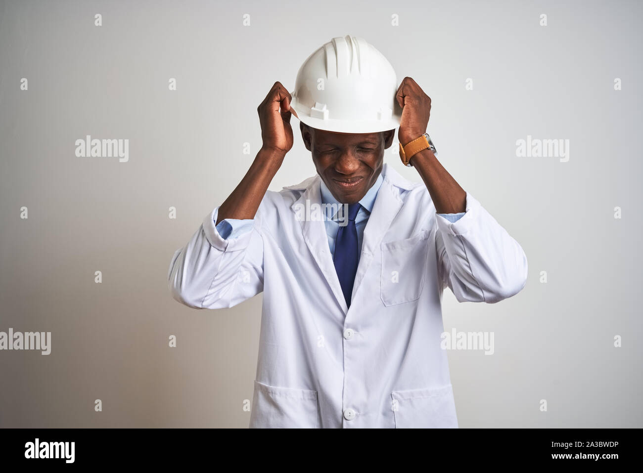 African american engineer man wearing coat and helmet over isolated ...