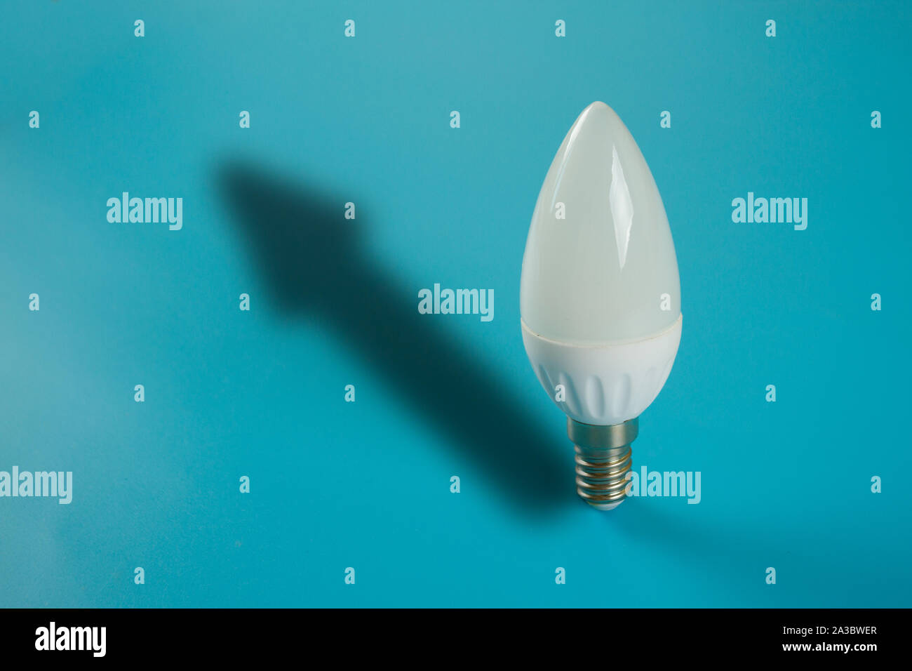 Light bulb as an idea symbol on blue background Stock Photo - Alamy