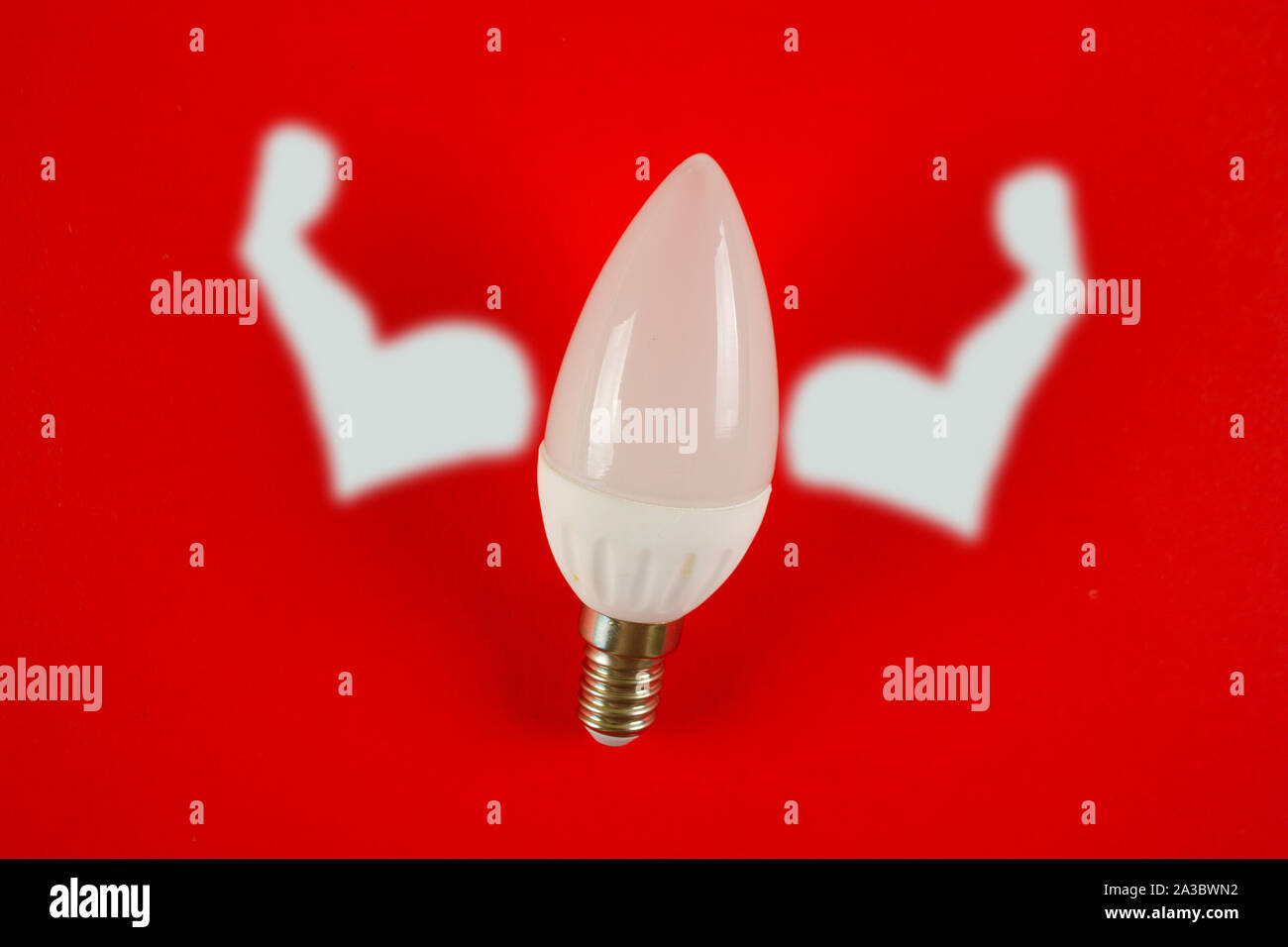 Strong idea concept. Light bulb with muscles Stock Photo - Alamy