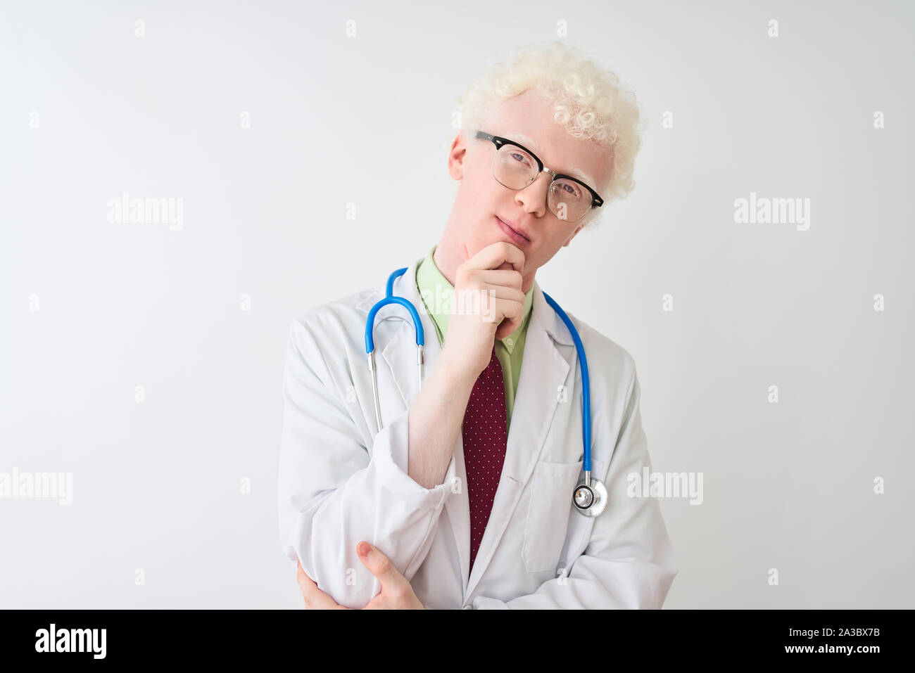 Young albino doctor man wearing stethoscope standing over isolated ...