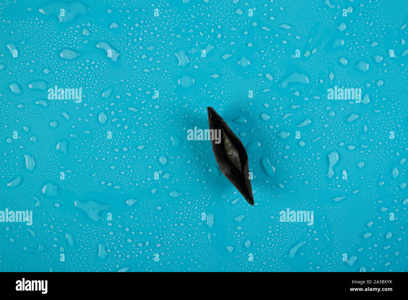Black paper ship made of paper. Copy space Stock Photo - Alamy