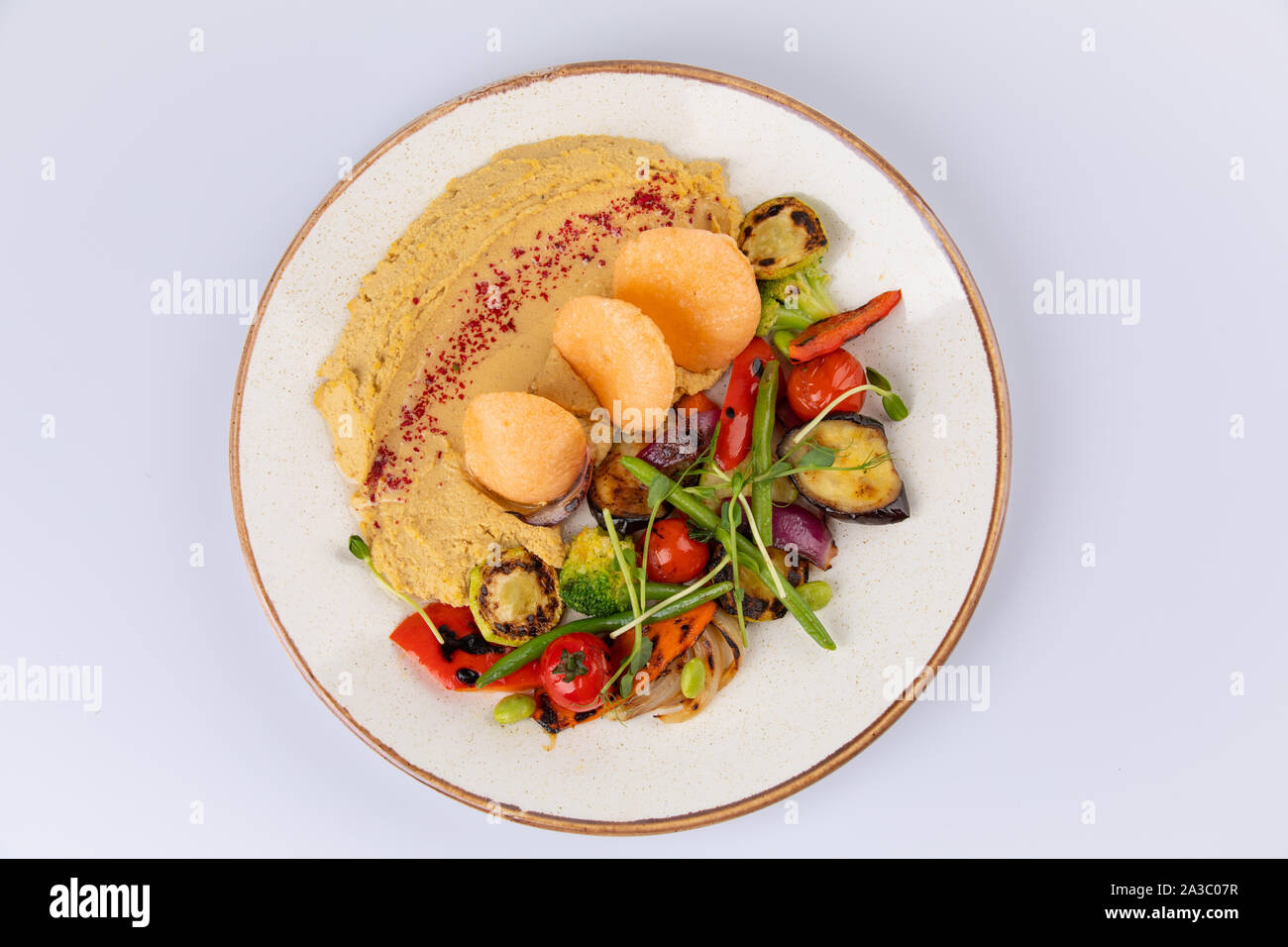 Kyufta or barbecue with snacks grilled vegetables, chips and hummuson ...