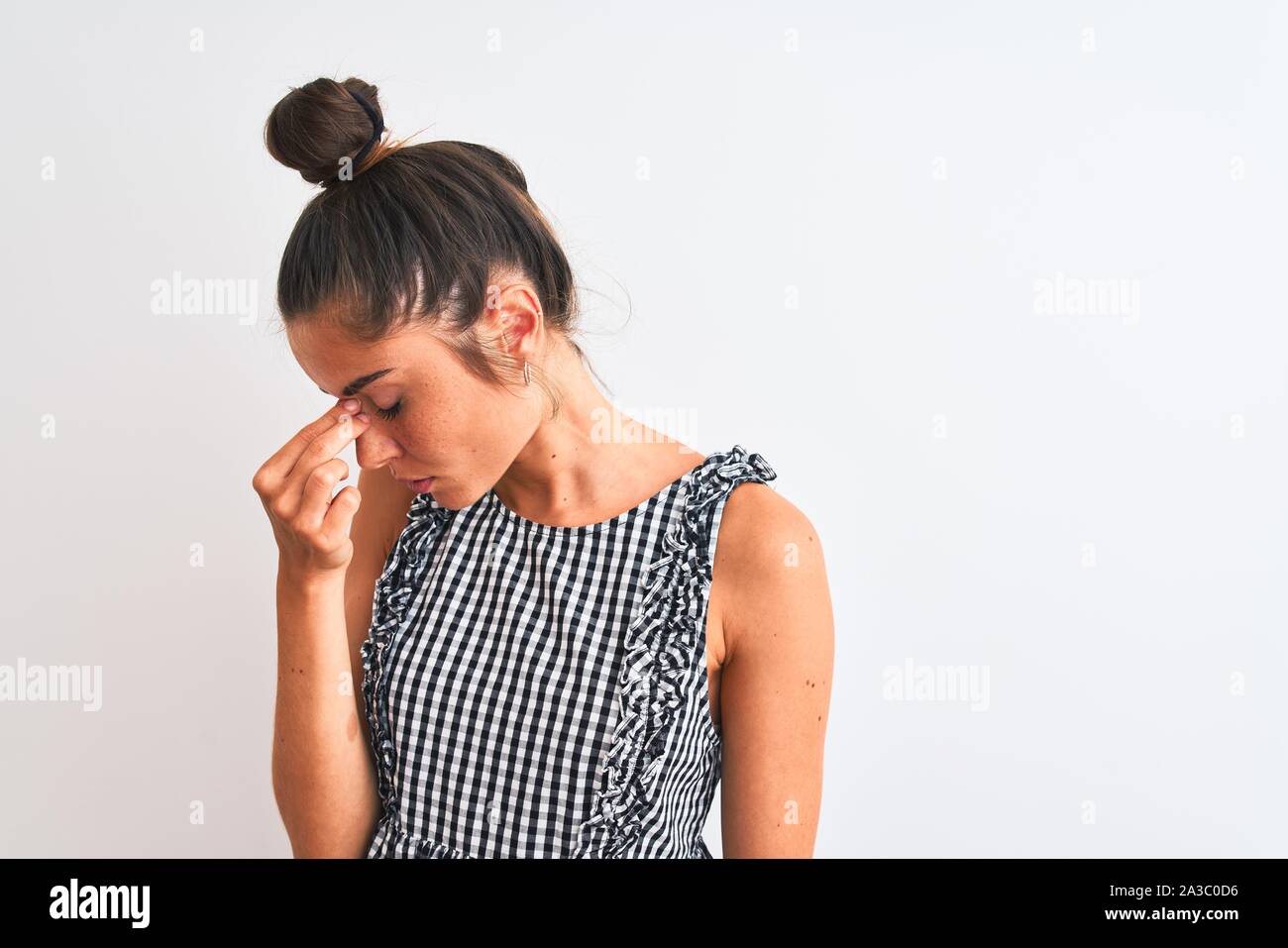 Beautiful Woman With Bun Wearing Casual Dresss Standing Over Isolated